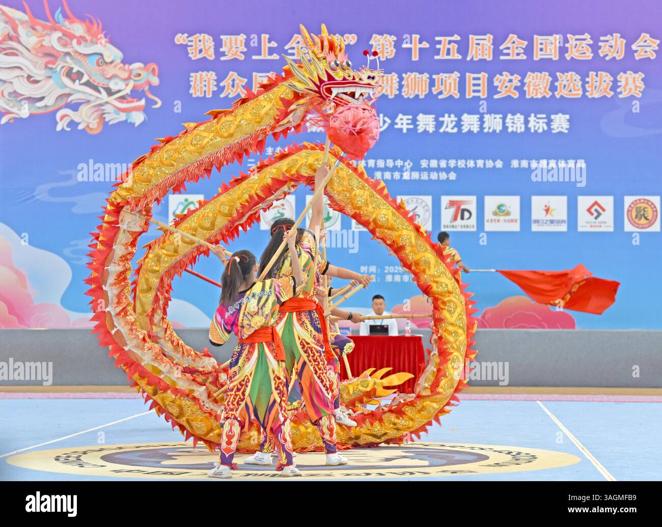 People perform at a ribbon dragon dance competition in Huainan City ...