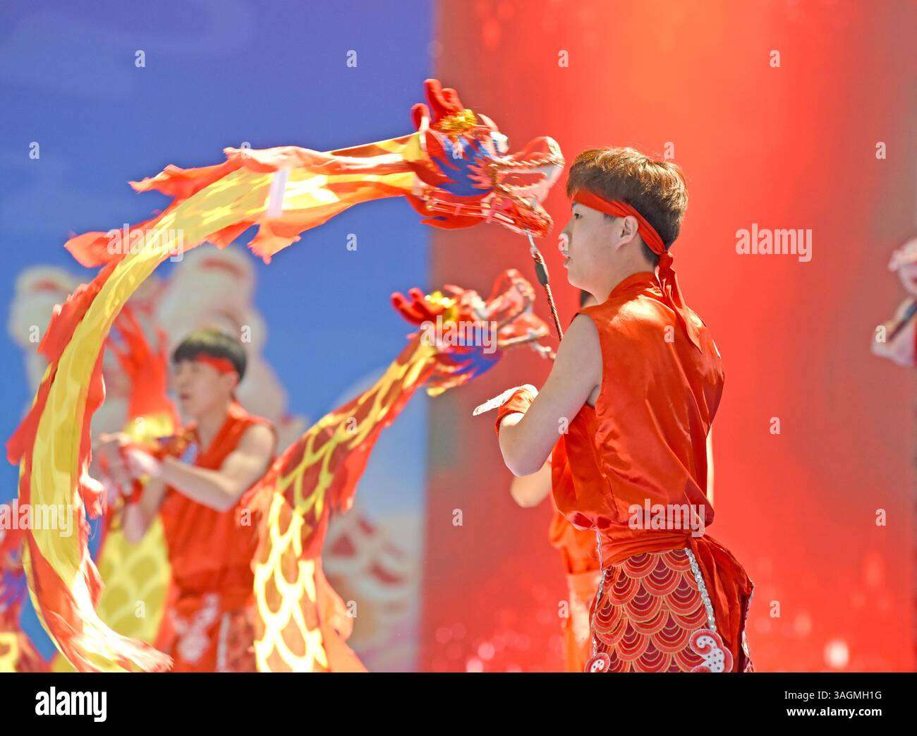 People perform at a ribbon dragon dance competition in Huainan City ...