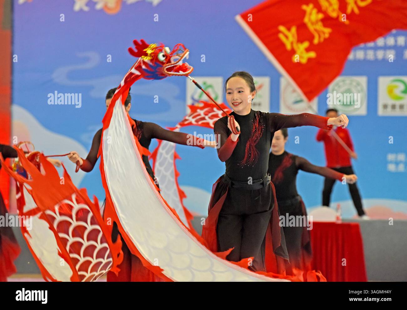 People perform at a ribbon dragon dance competition in Huainan City ...