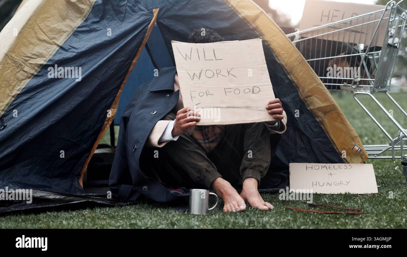 Person, homeless and cardboard for begging with cup, poverty and ask ...