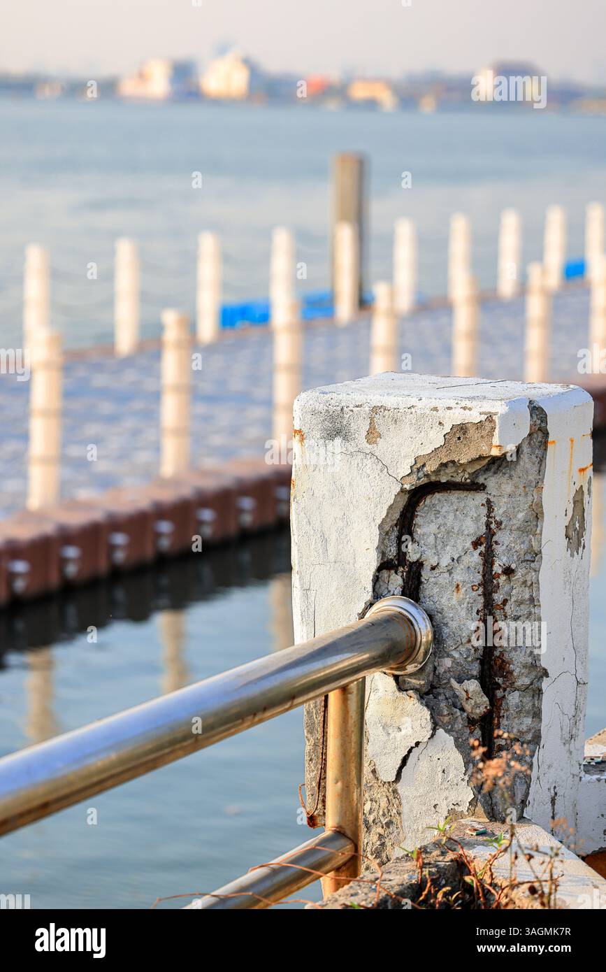 Cracked grey concrete surface with visible reinforcement, Rust in ...