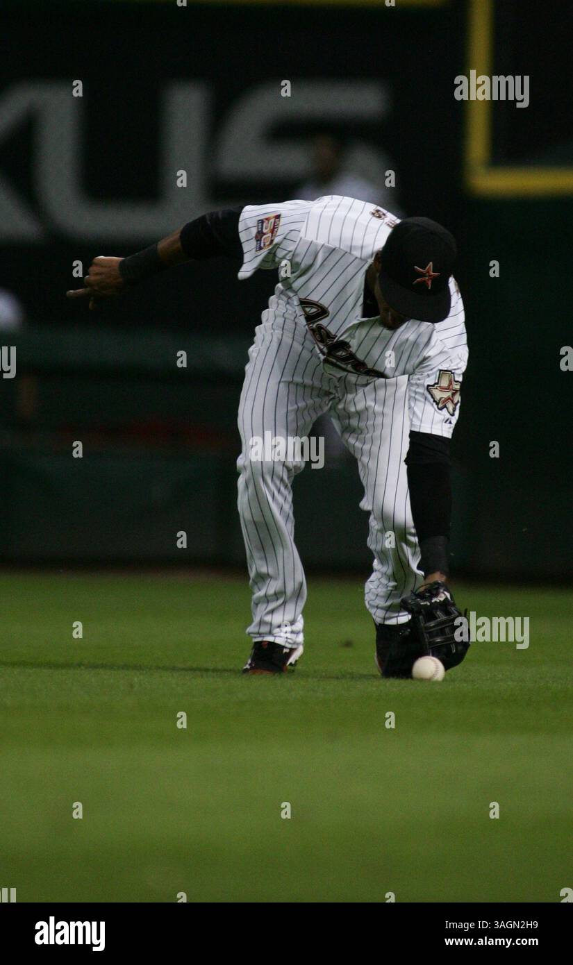 SEP 13 2012: Houston Astros outfielder Jimmy Paredes #38 reaches down ...