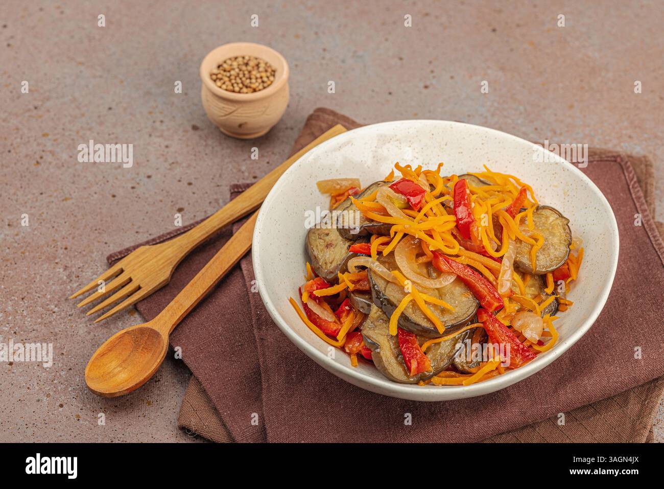 Vibrant salad in a trendy bowl. Fermented eggplant, bell pepper, carrot ...