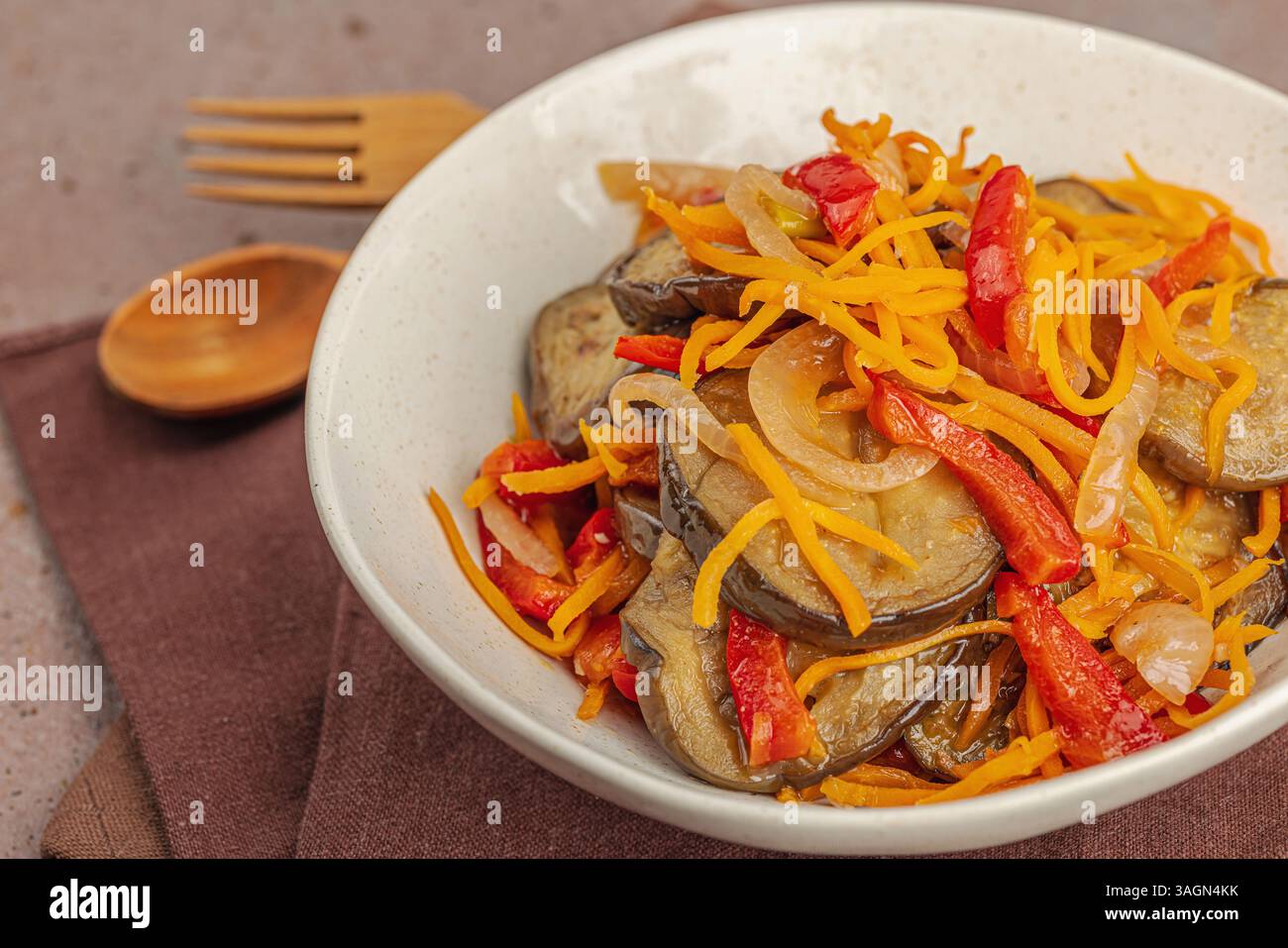 Vibrant salad in a trendy bowl. Fermented eggplant, bell pepper, carrot ...