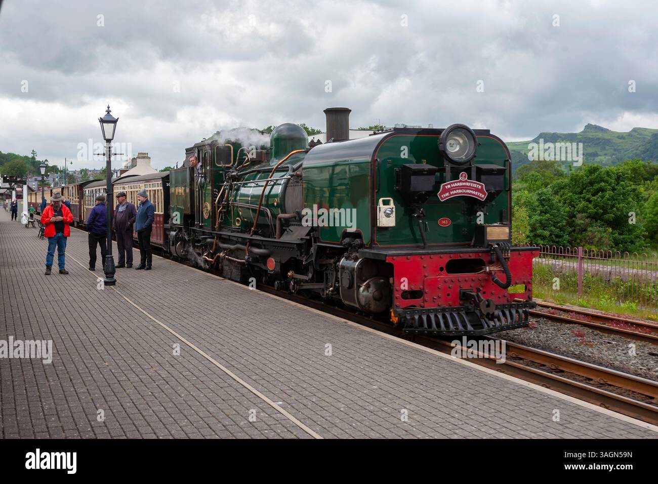 Garratt NG/G16 No.143 locomotive bringing a train in to Porthmadog station on the Welsh Highland ...