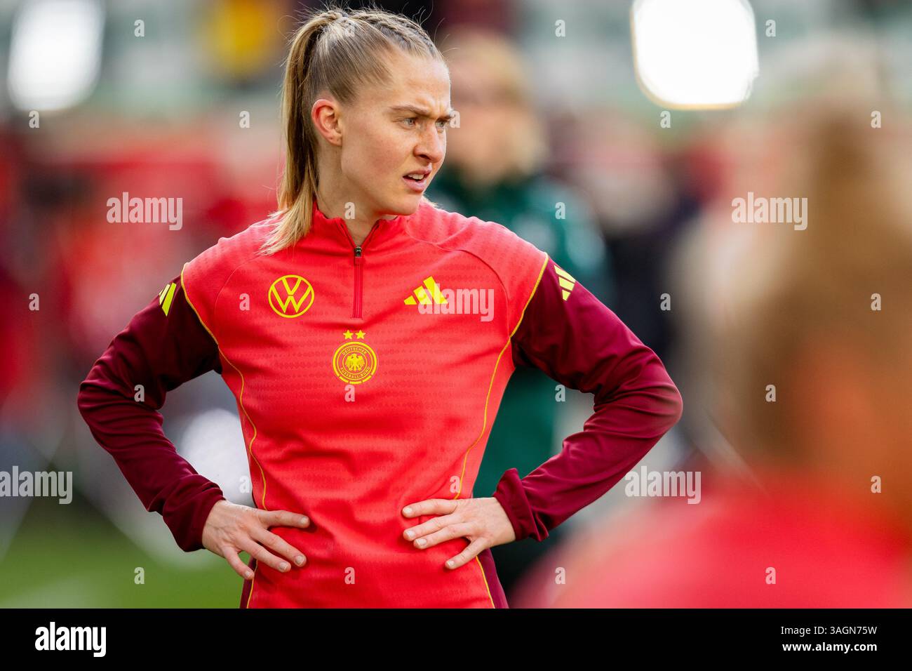 Wolfsburg, Germany. 08th Apr, 2025. Janina Minge of Germany is warming ...