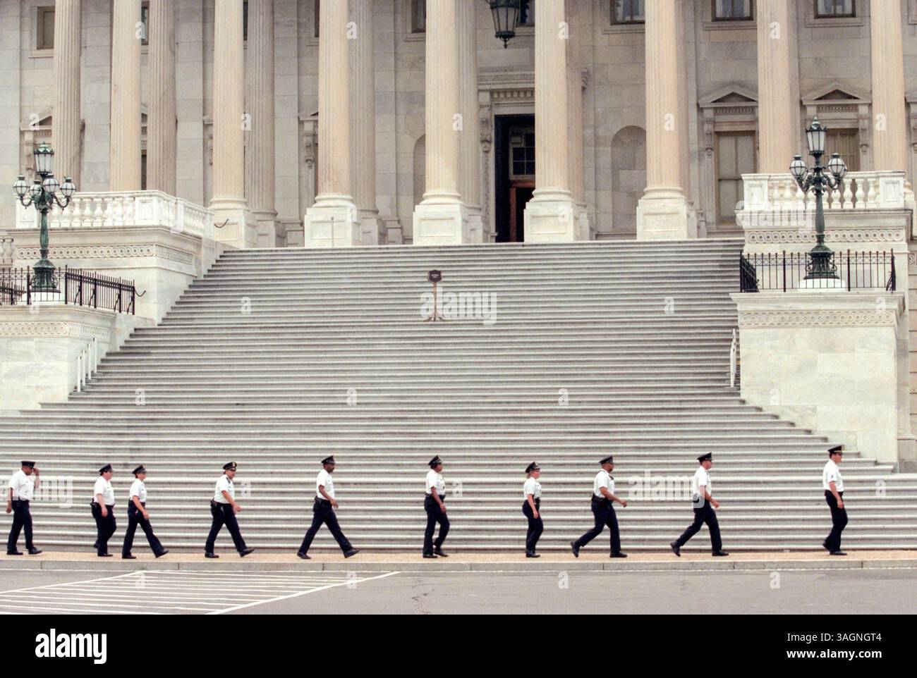 July 24, 1998 - US Capitol Police walk past the US Capitol after a ...