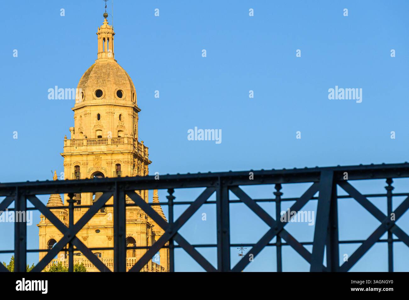 Balustrade of the Puente de los Peligros framing the medieval bell ...
