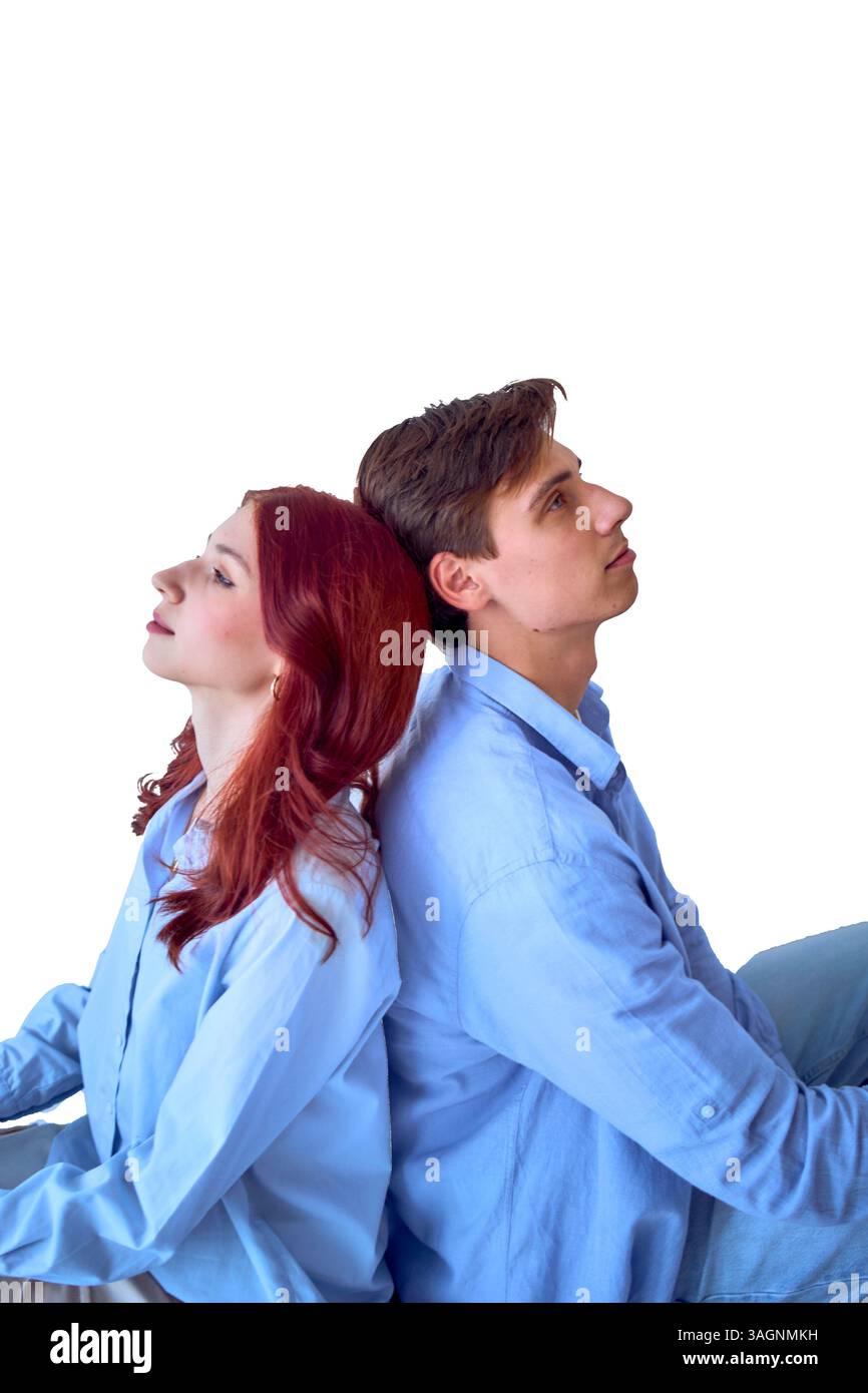 the siblings, young adult brother and teenage sister sitting back to ...