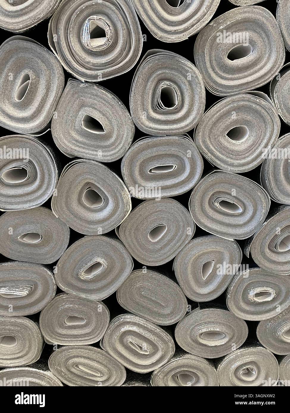 General stock. - Rolls of metallic floor foam laminate underlay at a ...