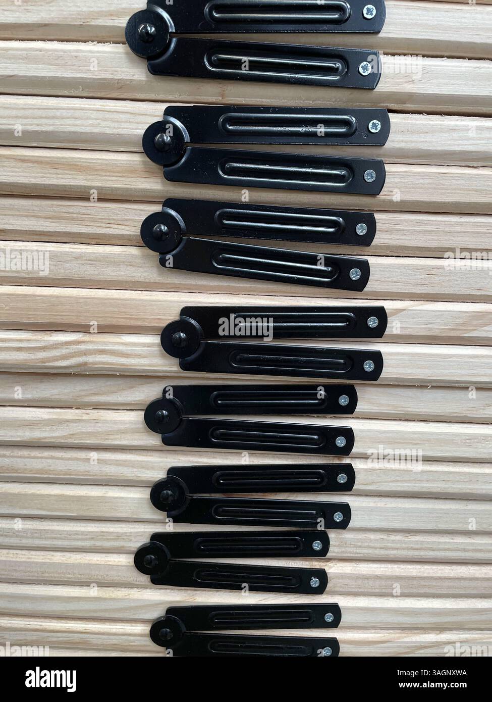 General stock. - Piles of wooden trestles with hinges facing at a DIY ...