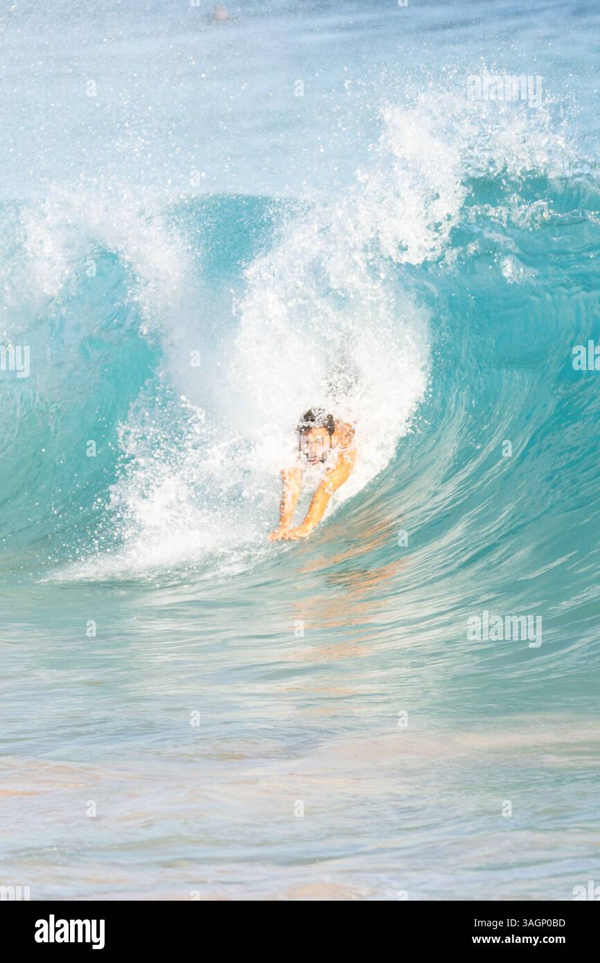 Body Surfer rides tropical wave at sunny beach, capturing summer fun ...