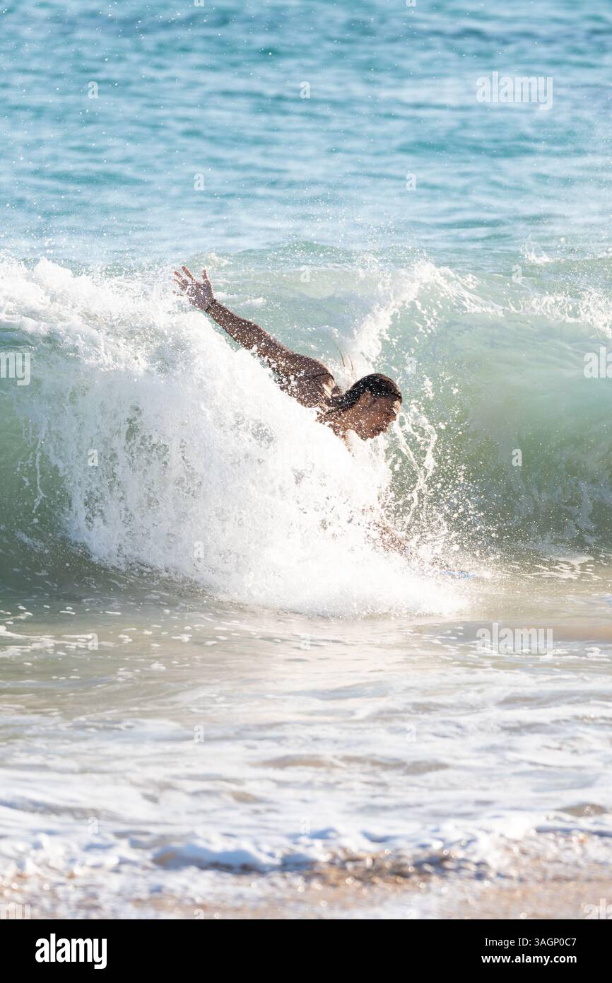 Body Surfer rides tropical wave at sunny beach, capturing summer fun ...