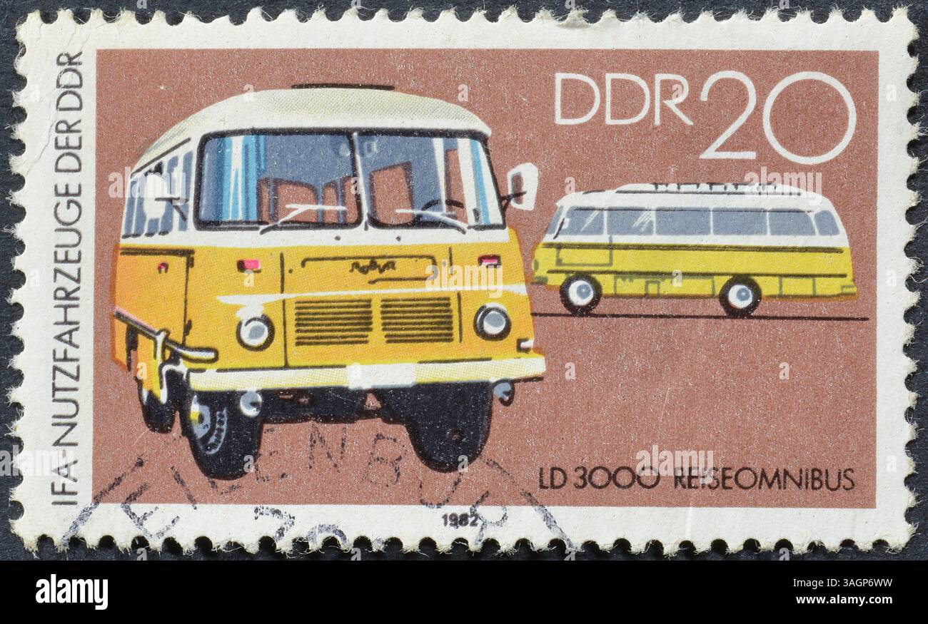 Cancelled postage stamp printed by East Germany, that shows Travel Bus ...