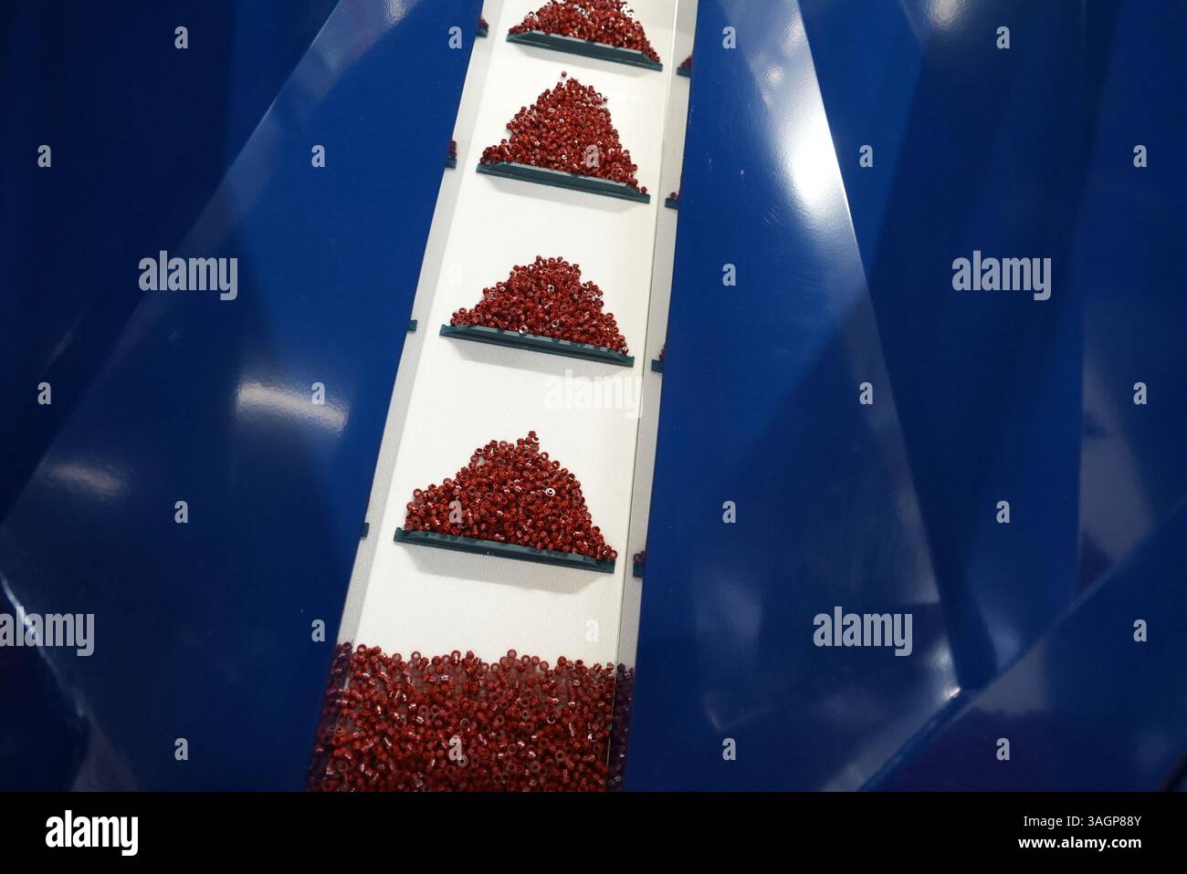 Lego pieces are moved in packing machine at Lego factory in Binh Duong ...