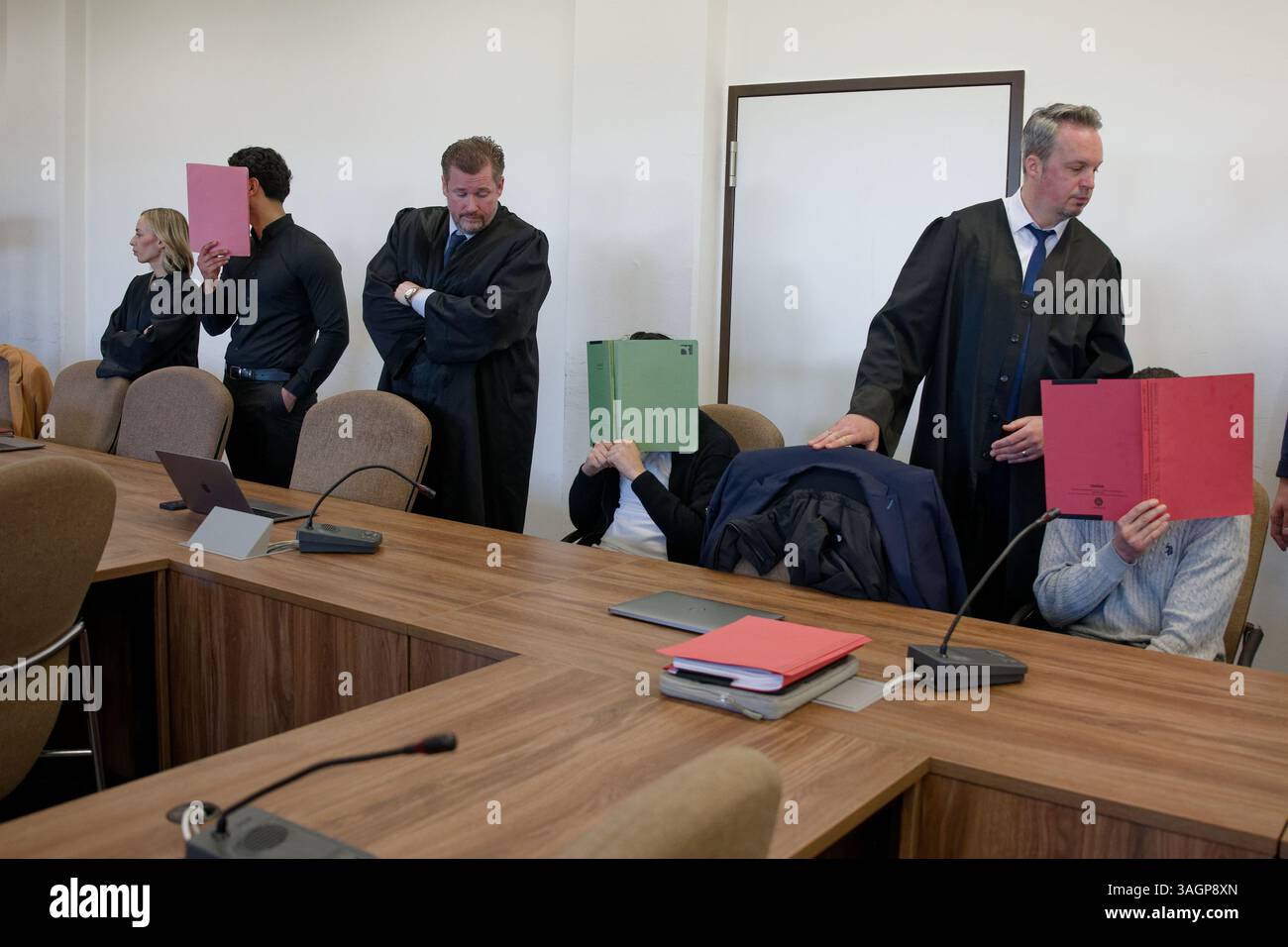09 April 2025, North Rhine-Westphalia, Cologne: Three defendants and ...