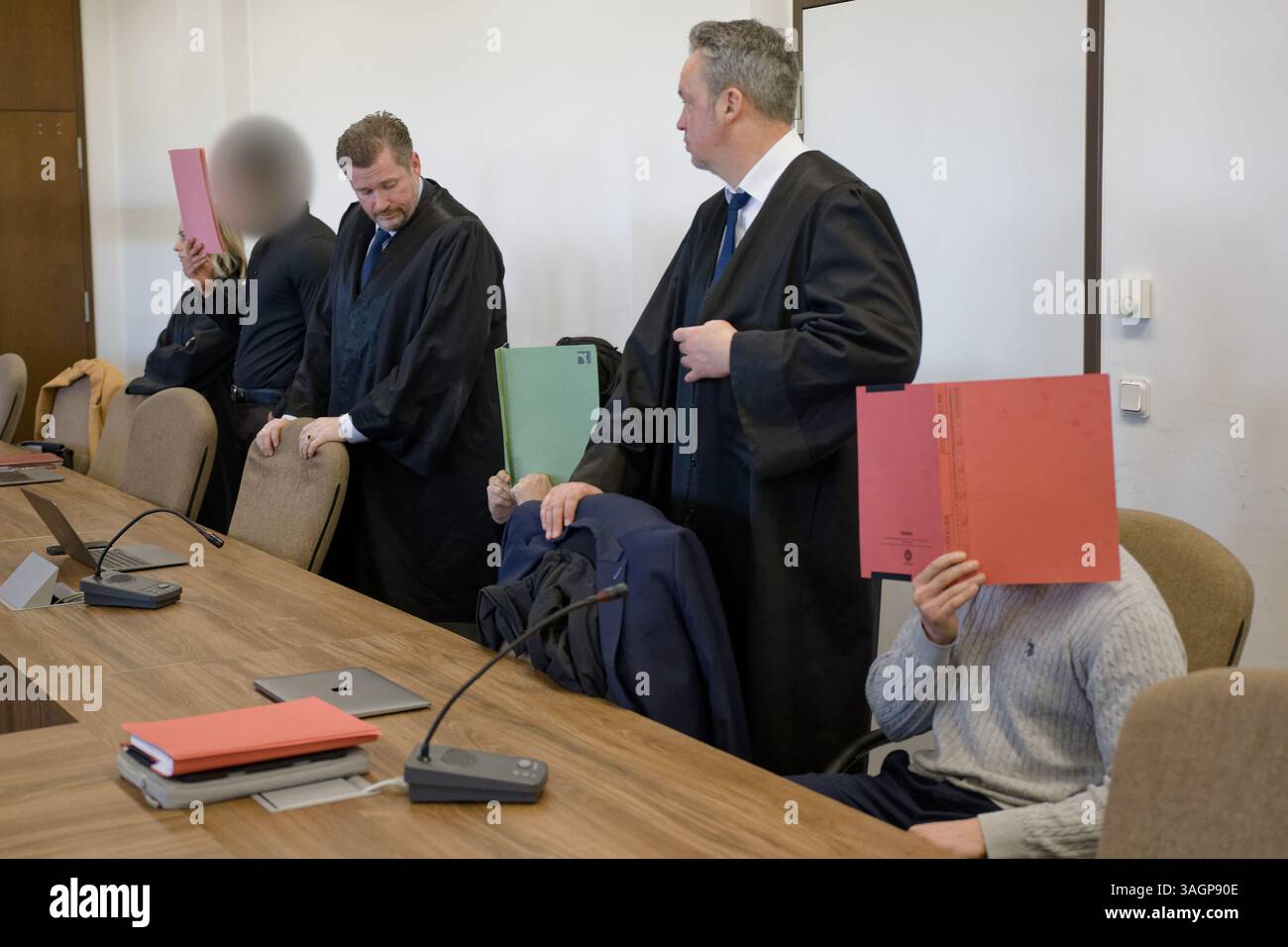 Cologne, Germany. 09th Apr, 2025. Three defendants and their lawyers ...