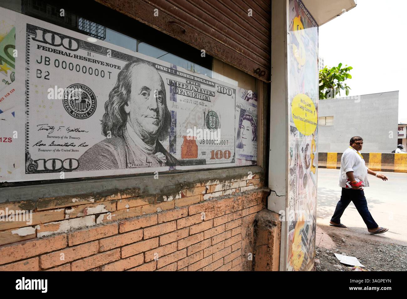 A poster showing U. S. dollar is displayed outside a forex shop in ...