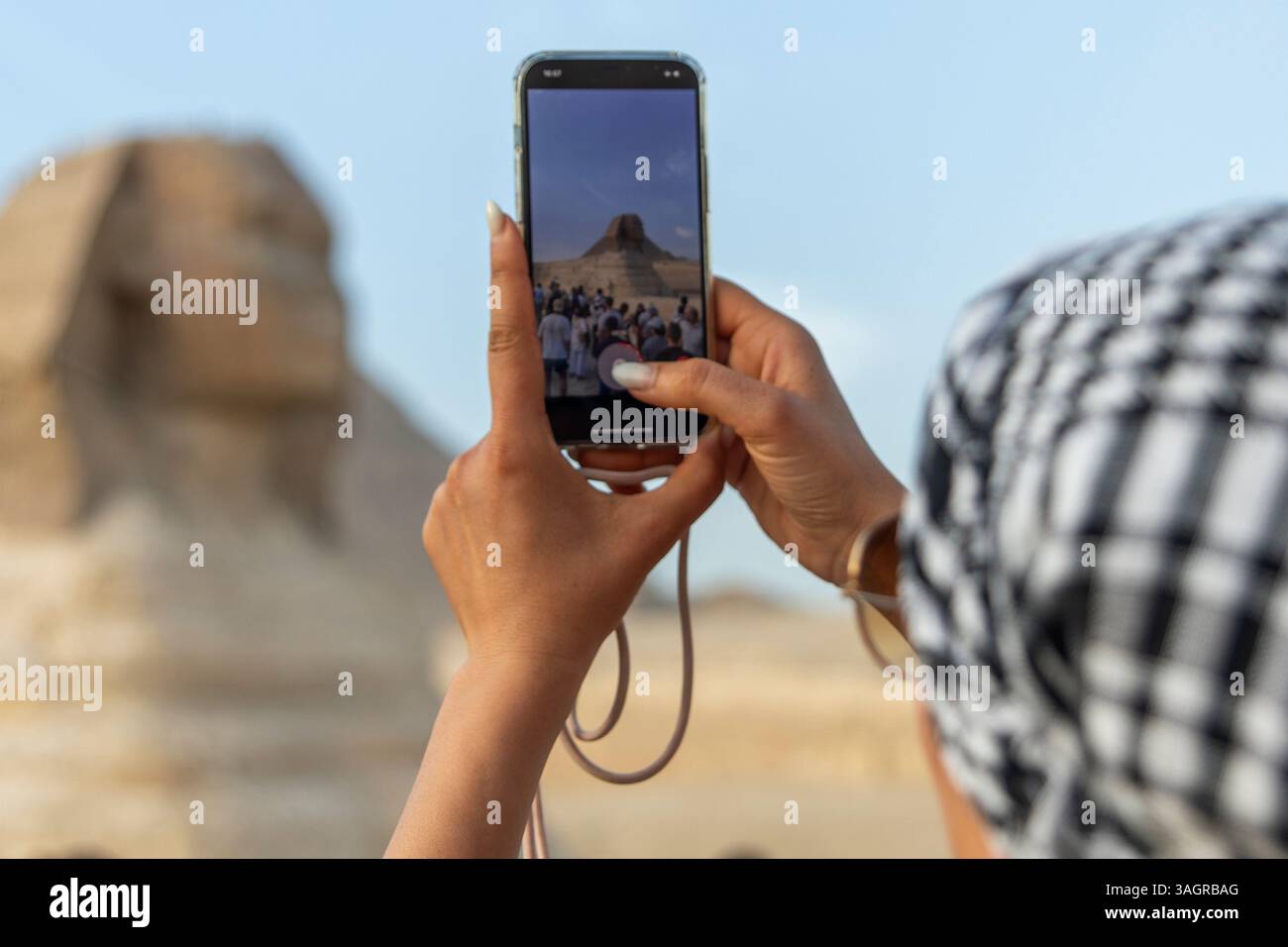 Cairo, Egypt; January 20, 2024: Capture a tourist photographing the ...