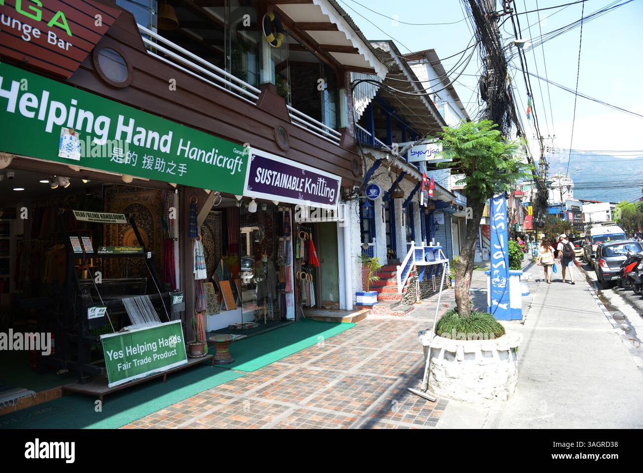 Shops along Lakeside Rd. in Pokhara, Nepal Stock Photo - Alamy