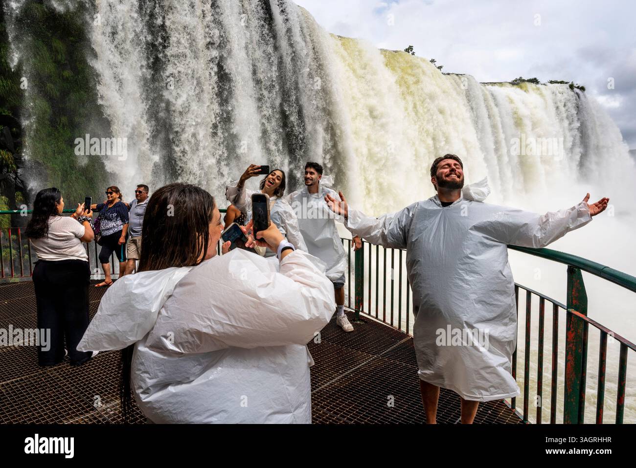 Tourists Pose For Photos At The Devil's Throat (Brazilian Side), Iguacu ...
