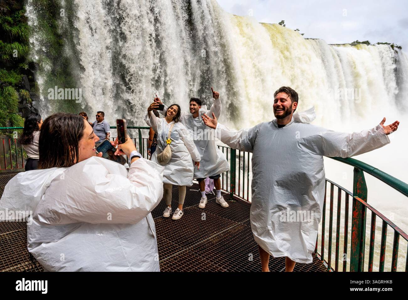 Tourists Pose For Photos At The Devil's Throat (Brazilian Side), Iguacu Falls, Iguacu National ...