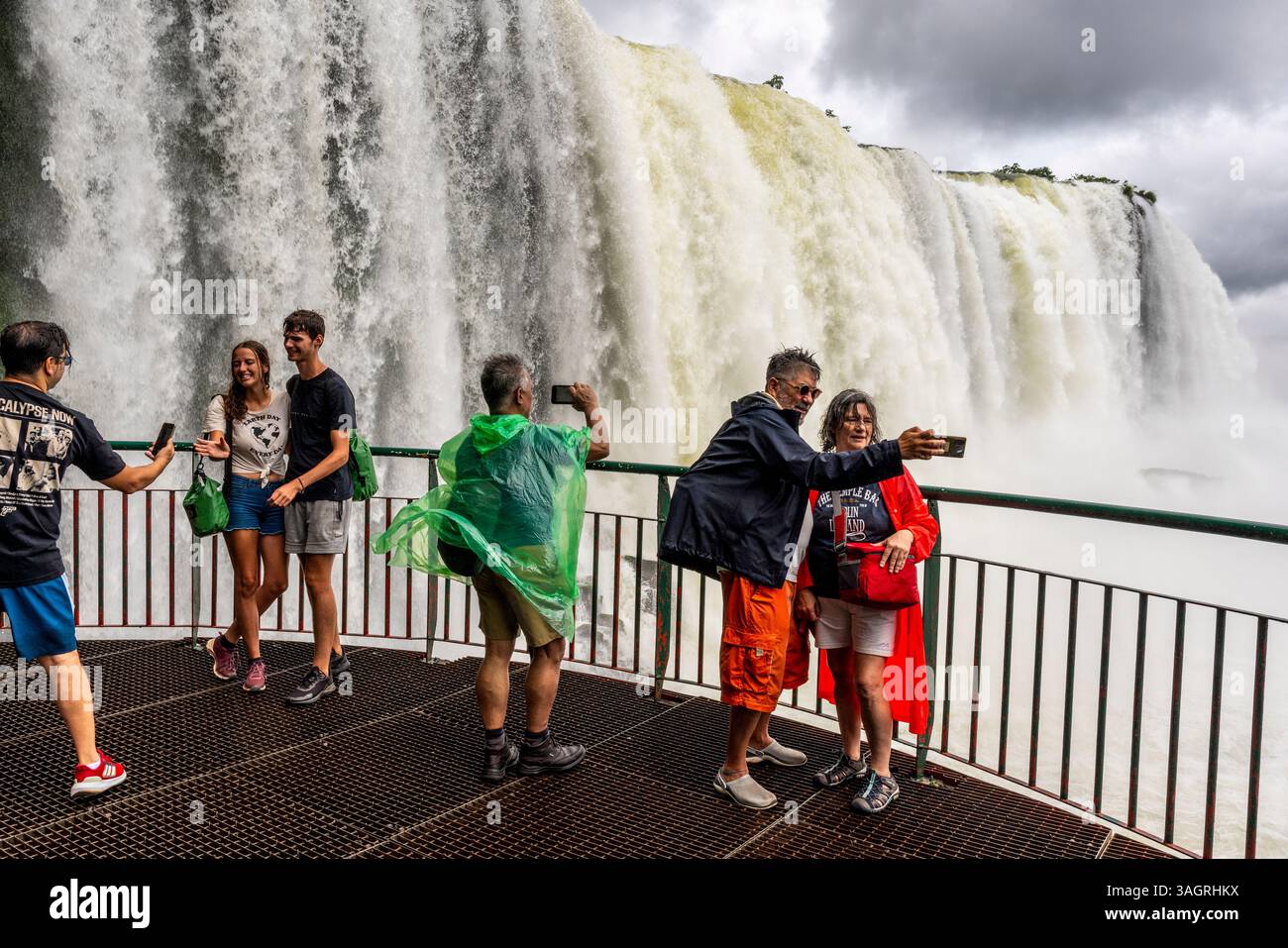 Tourists Pose For Photos At The Devil's Throat (Brazilian Side), Iguacu ...