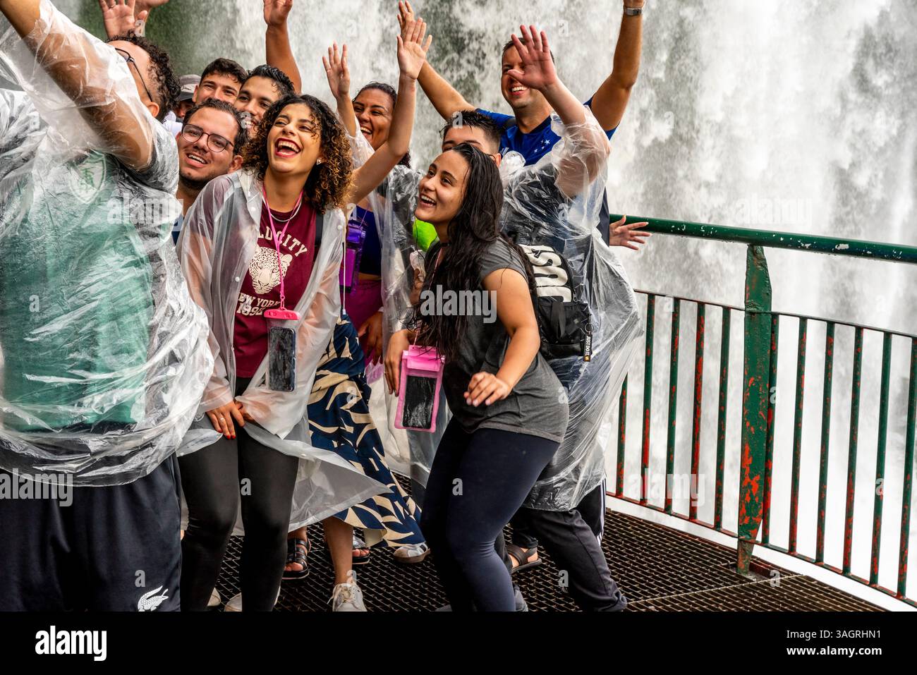 Tourists Pose For Photos At The Devil's Throat (Brazilian Side), Iguacu ...