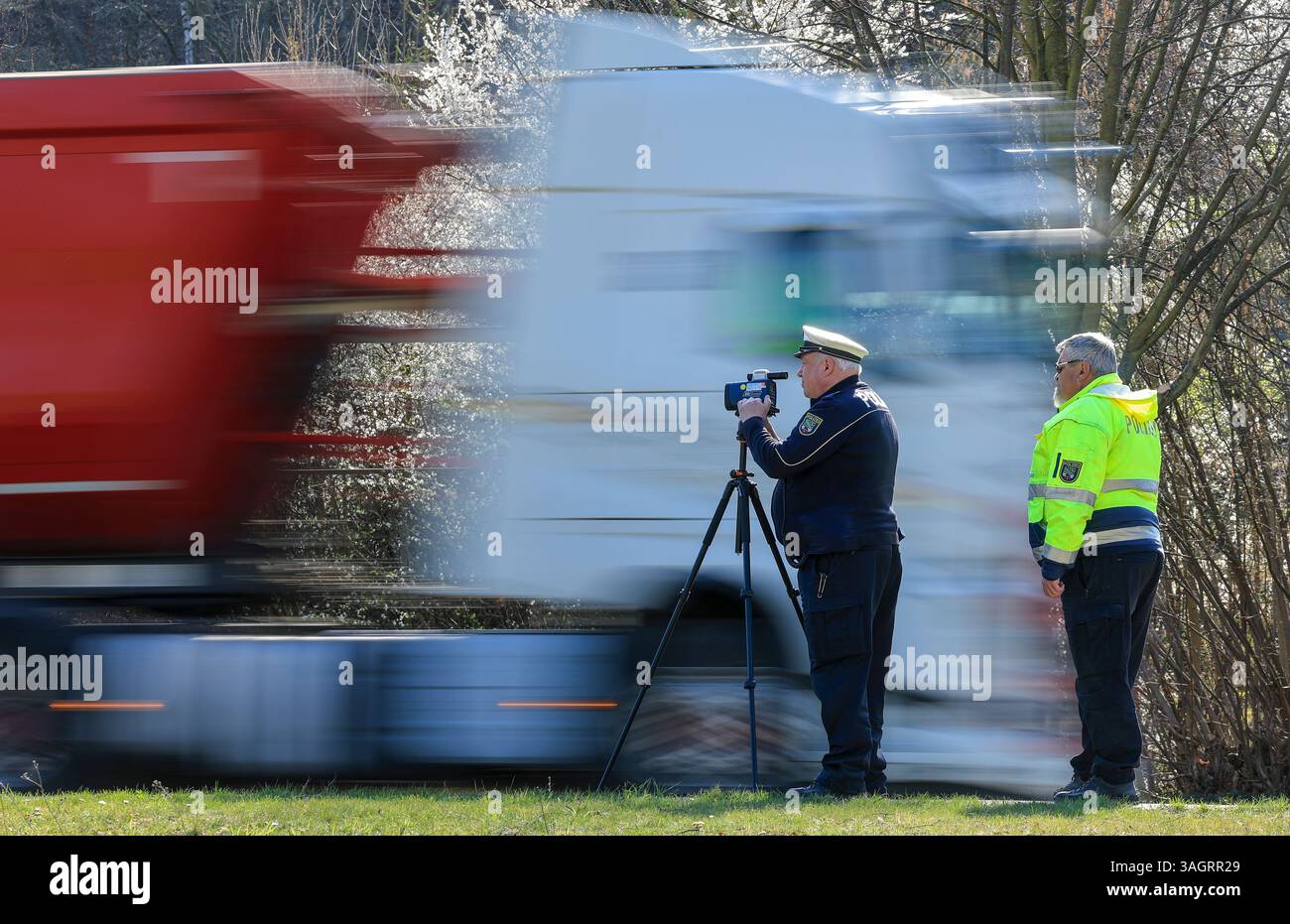 Mansfeld, Germany. 09th Apr, 2025. A police officer measures car and ...