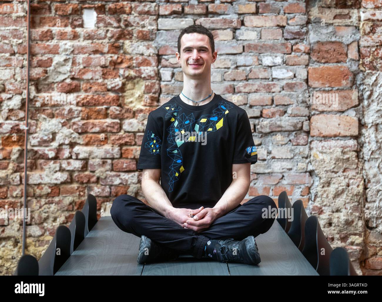 Czech sport climber Adam Ondra poses for photographers after a press ...