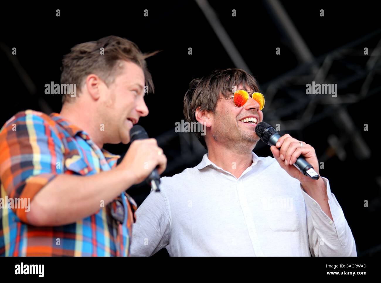 Jamie Oliver and Alex James at Big Feastival held at Alex James’ farm ...