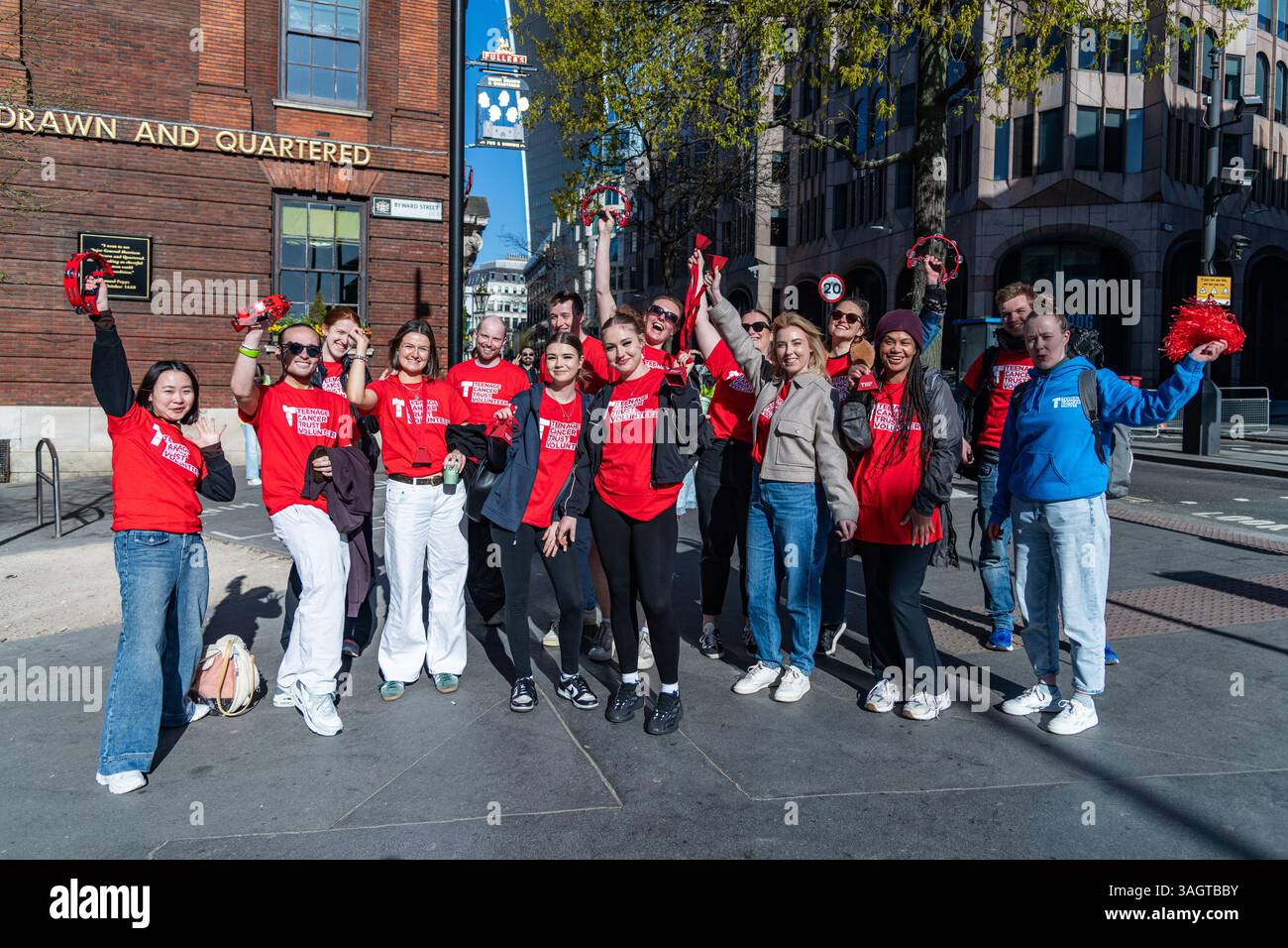 People supporting and cheering the runners in the street during the ...