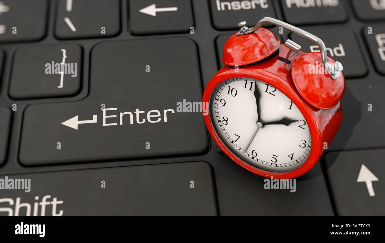 Wecker steht auf PC Tastatur Symbolbild zum Thema Zeitdruck, Deadline ...