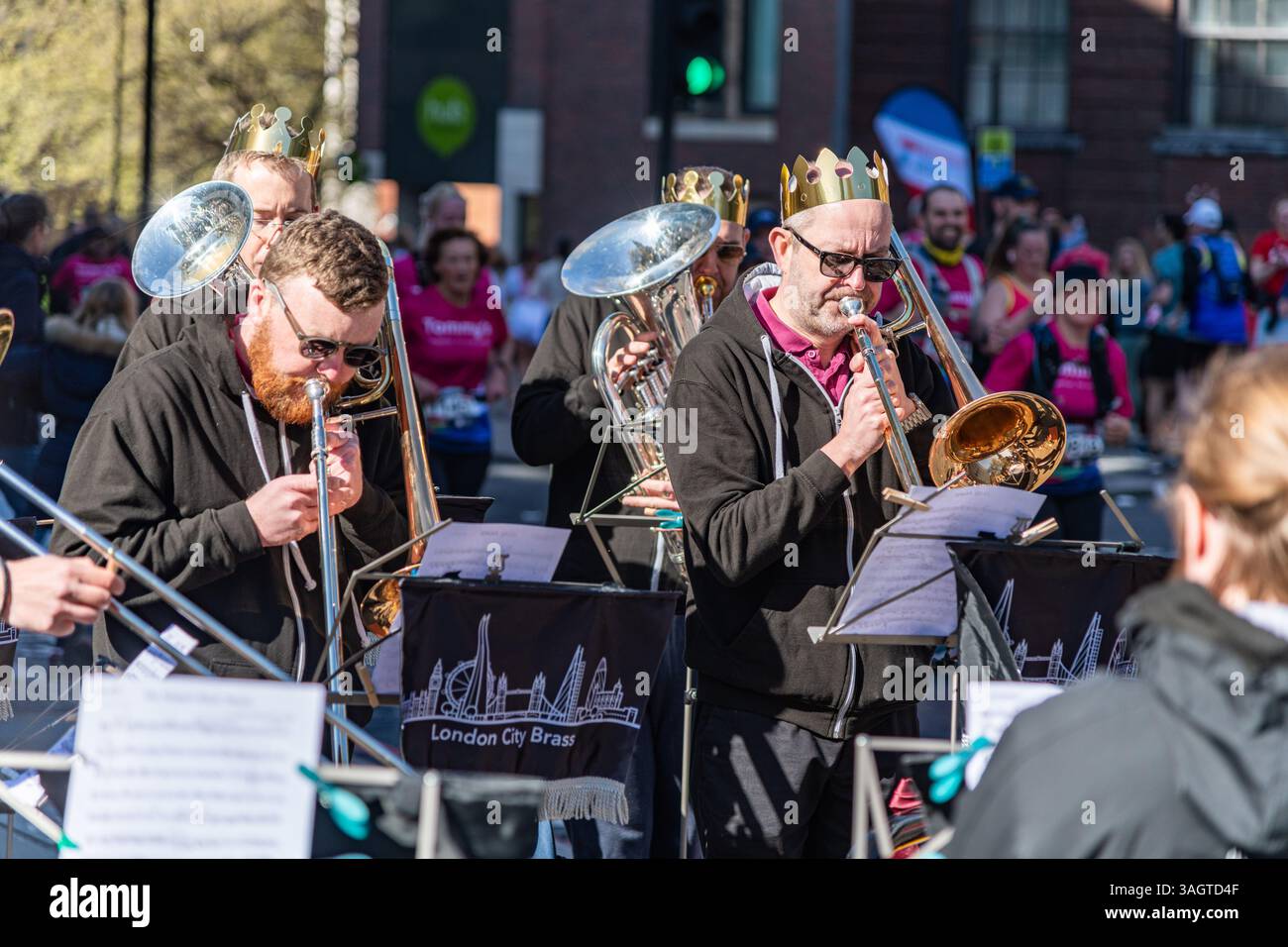 The London City Brass band performing music for people running in the ...