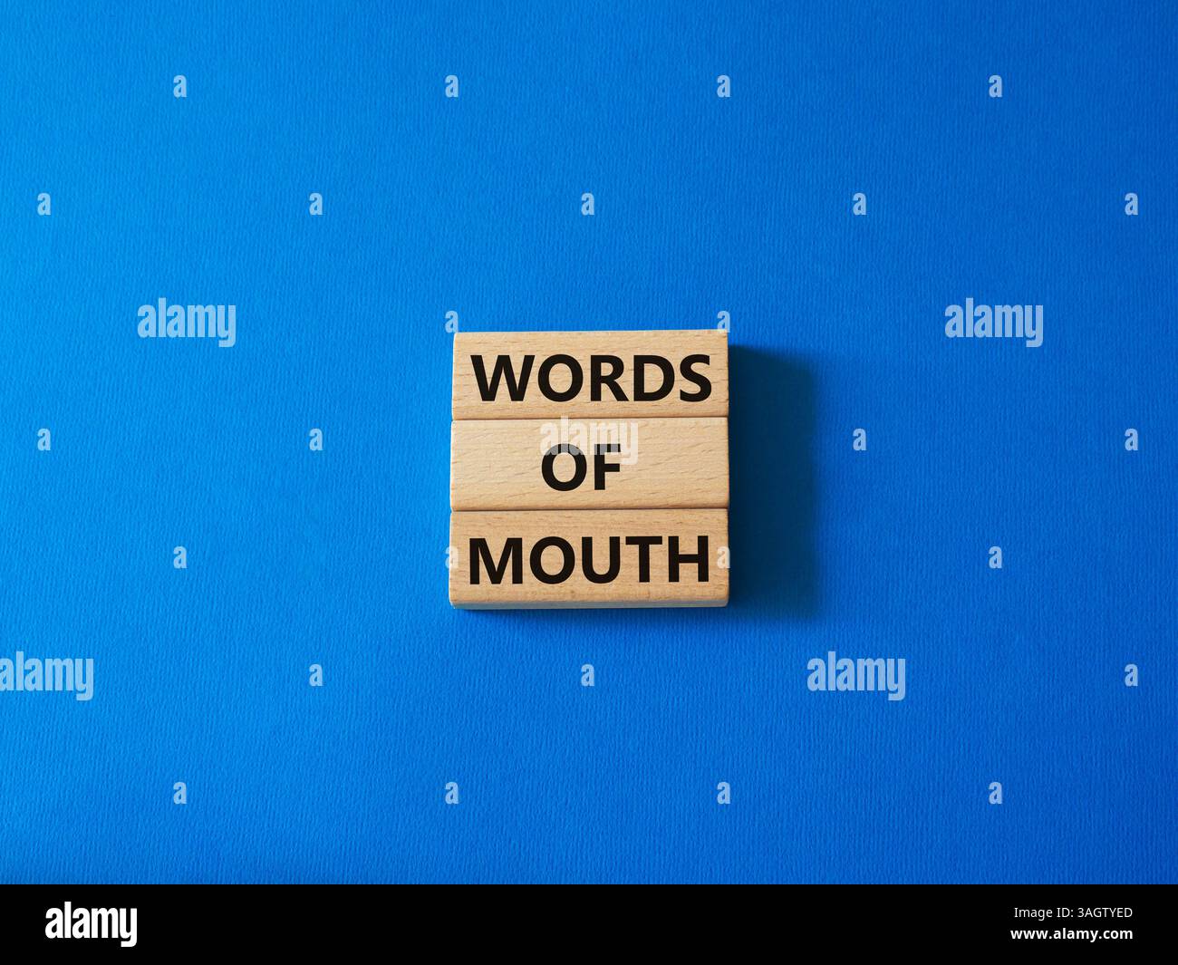 Words of mouth symbol. Concept word Words of mouth on wooden blocks ...