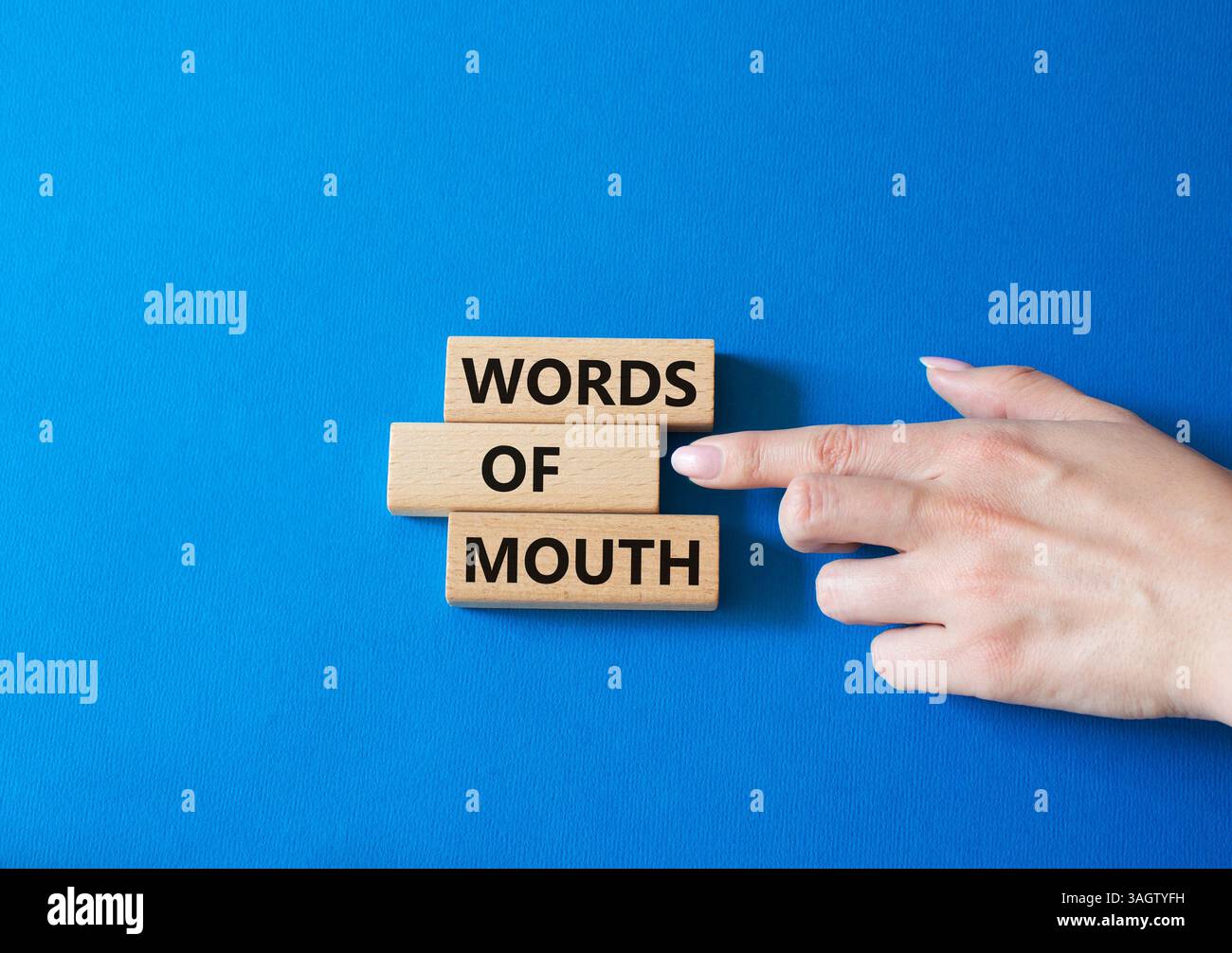 Words of mouth symbol. Concept word Words of mouth on wooden blocks ...