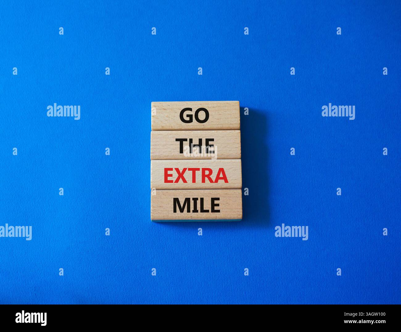 Go the extra mile symbol. Wooden blocks with words Go the extra mile ...