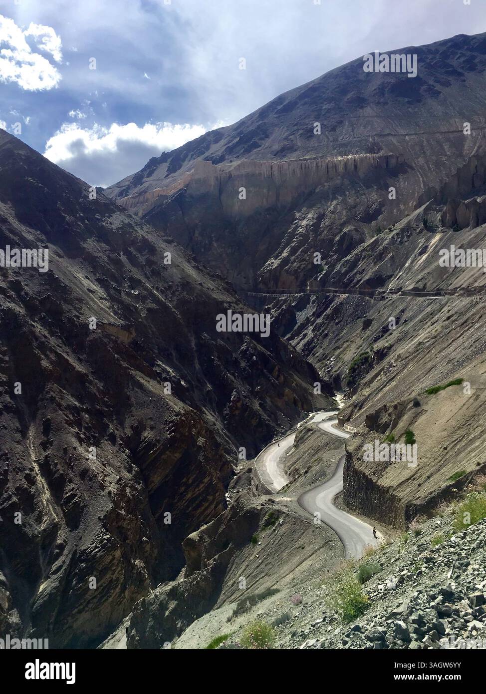 A winding road cuts through the dramatic landscape of the Leh Ladakh ...