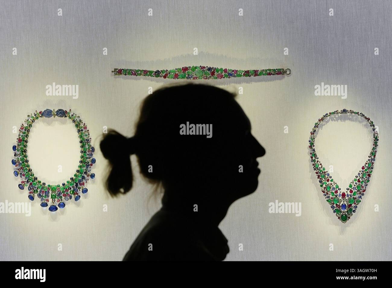 A museum employee looks towards items on display at Cartier – the first ...