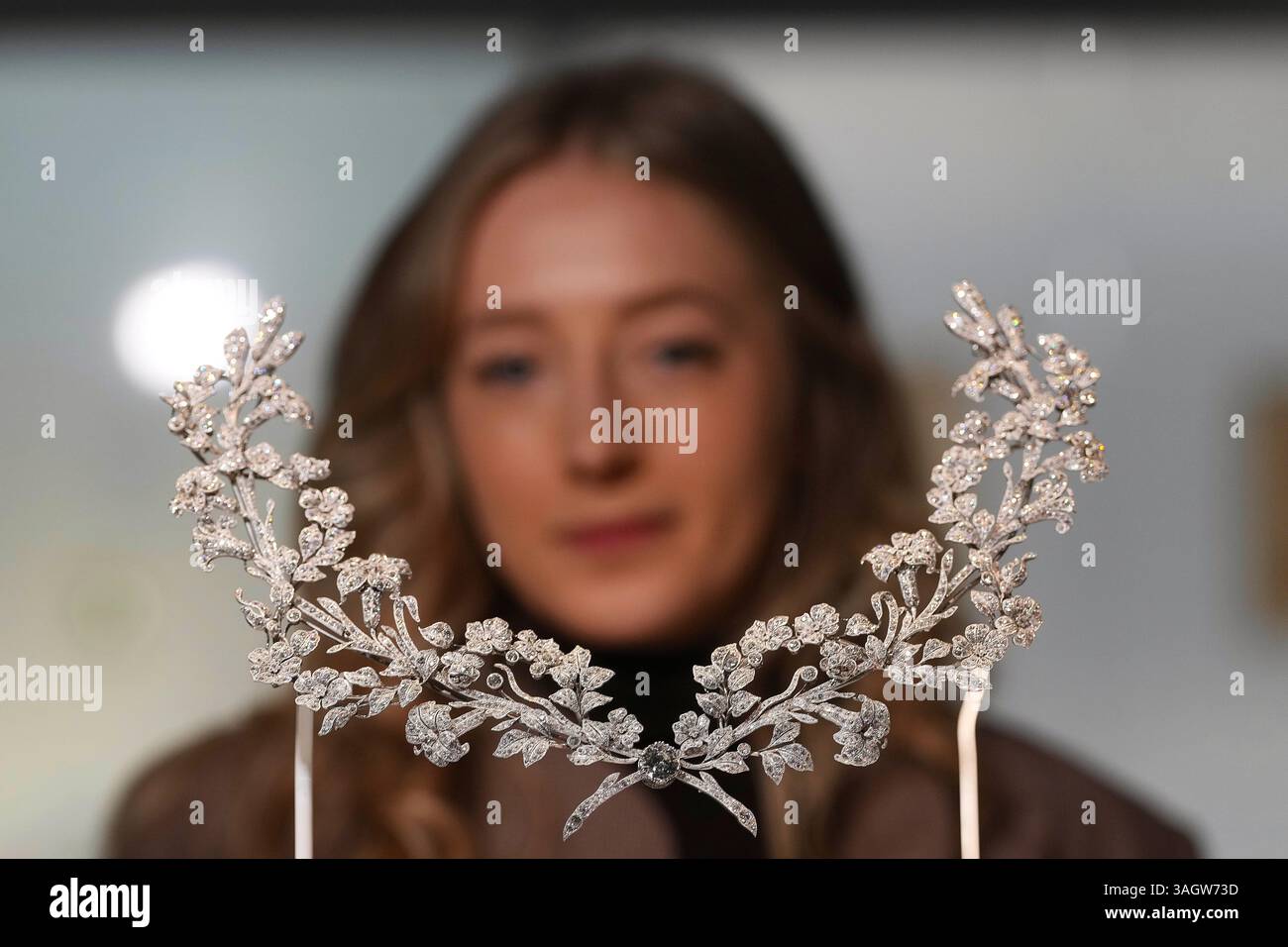 A museum employee looks at an item on display at Cartier – the first ...