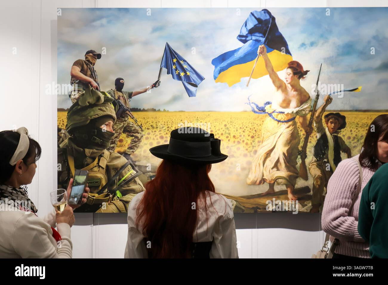 Visitors look at the collage by French artist Fanny Lechevalier, which ...