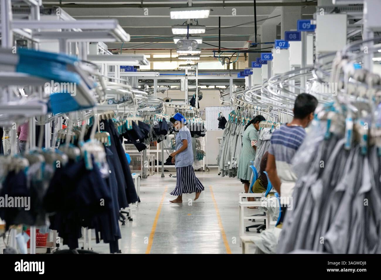 Workers are seen in an apparel factory at the Katunayake export ...