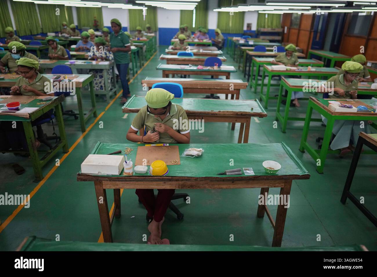 Workers are seen in a handmade jewelry factory at the Katunayake export ...