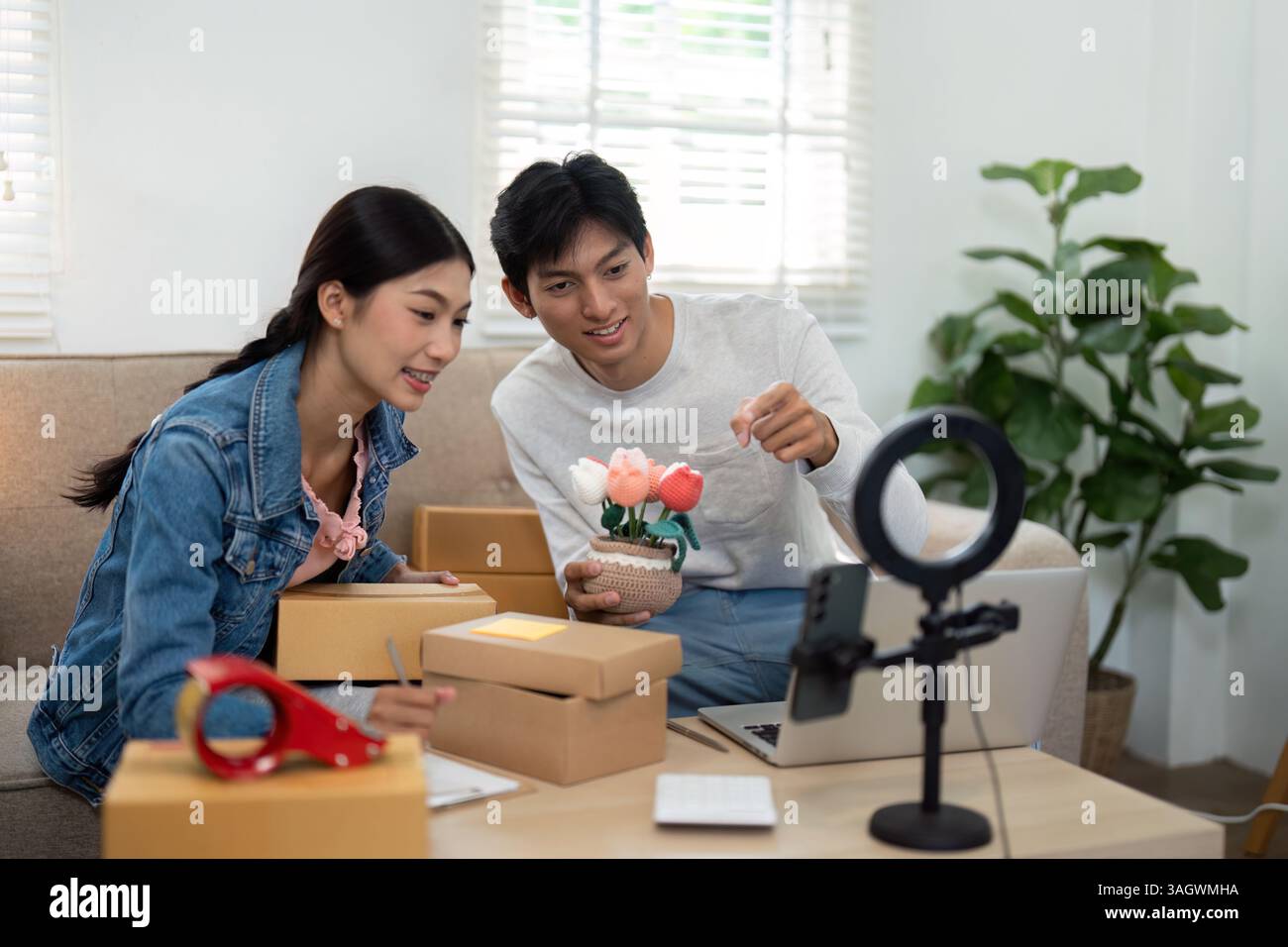 Live Streaming and Online Engagement. A couple preparing for a live ...