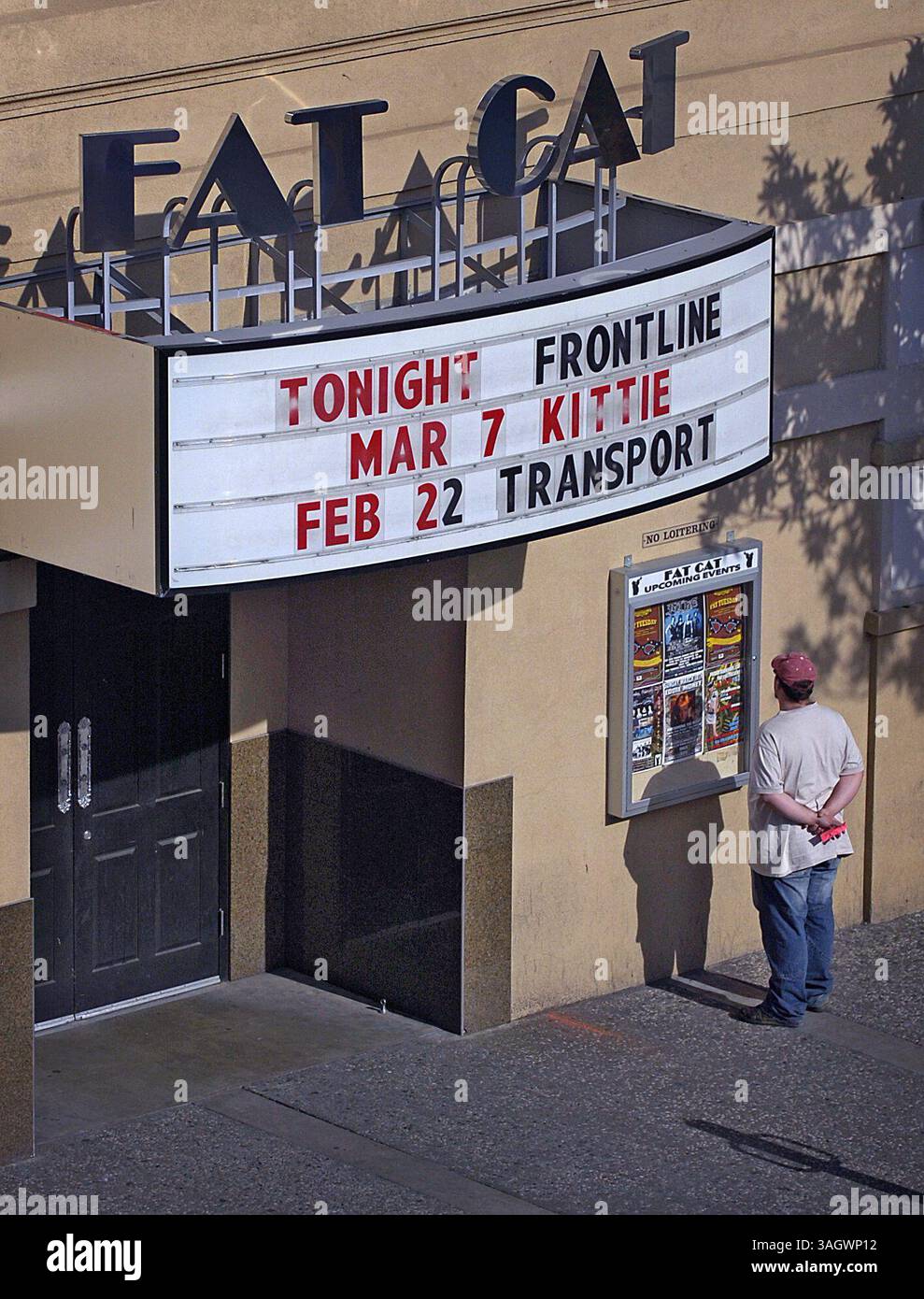 A pedestrian stops to look at the line-up of upcoming talent in front ...