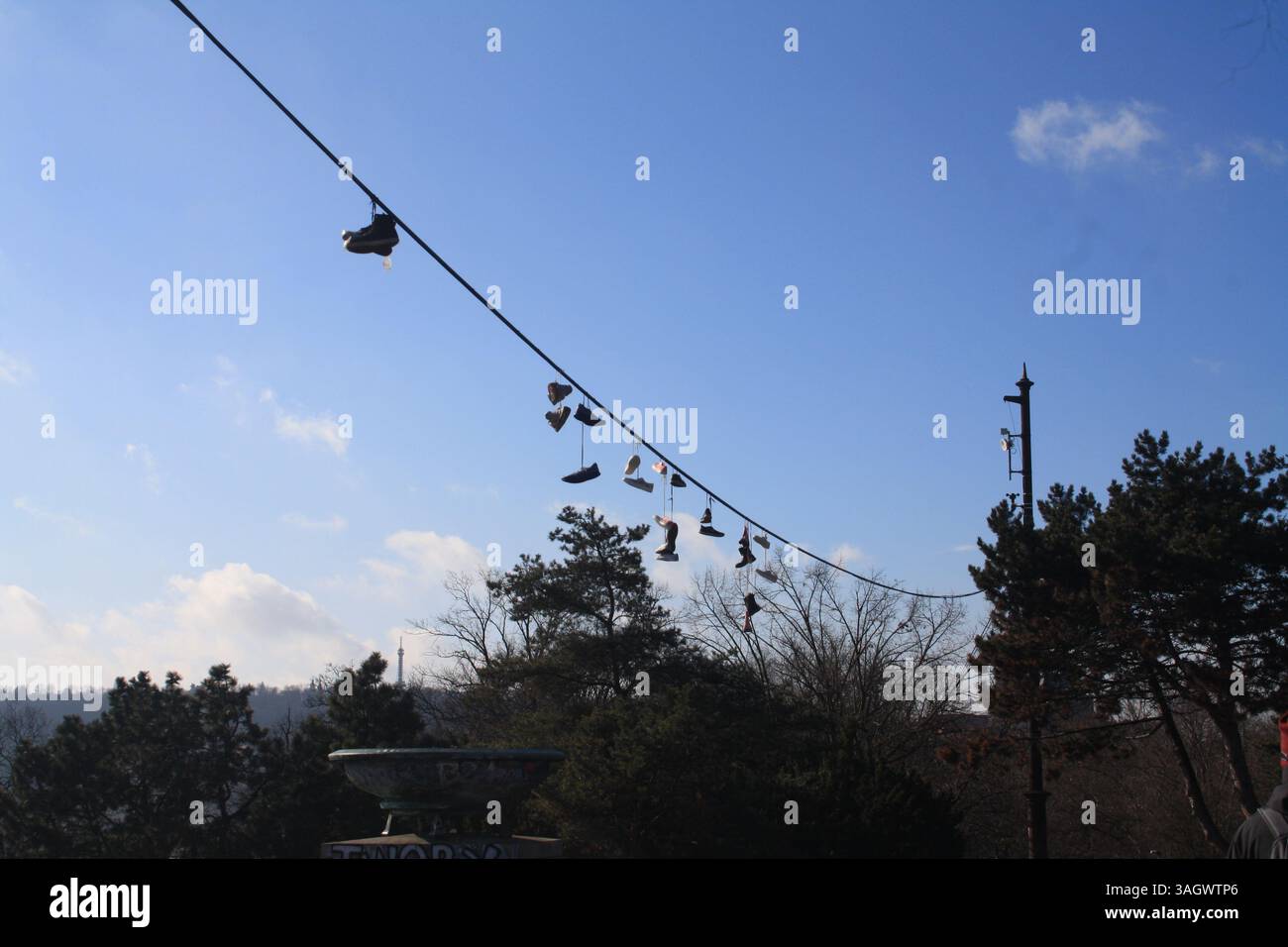 Hanging boots in electricity wire hi-res stock photography and images ...