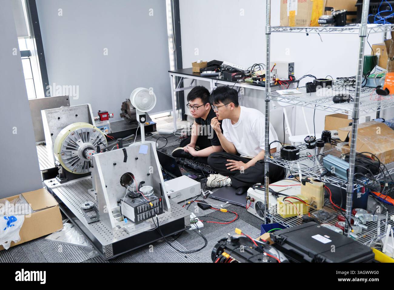 Shenzhen, China's Guangdong Province. 27th Mar, 2025. Staff members ...