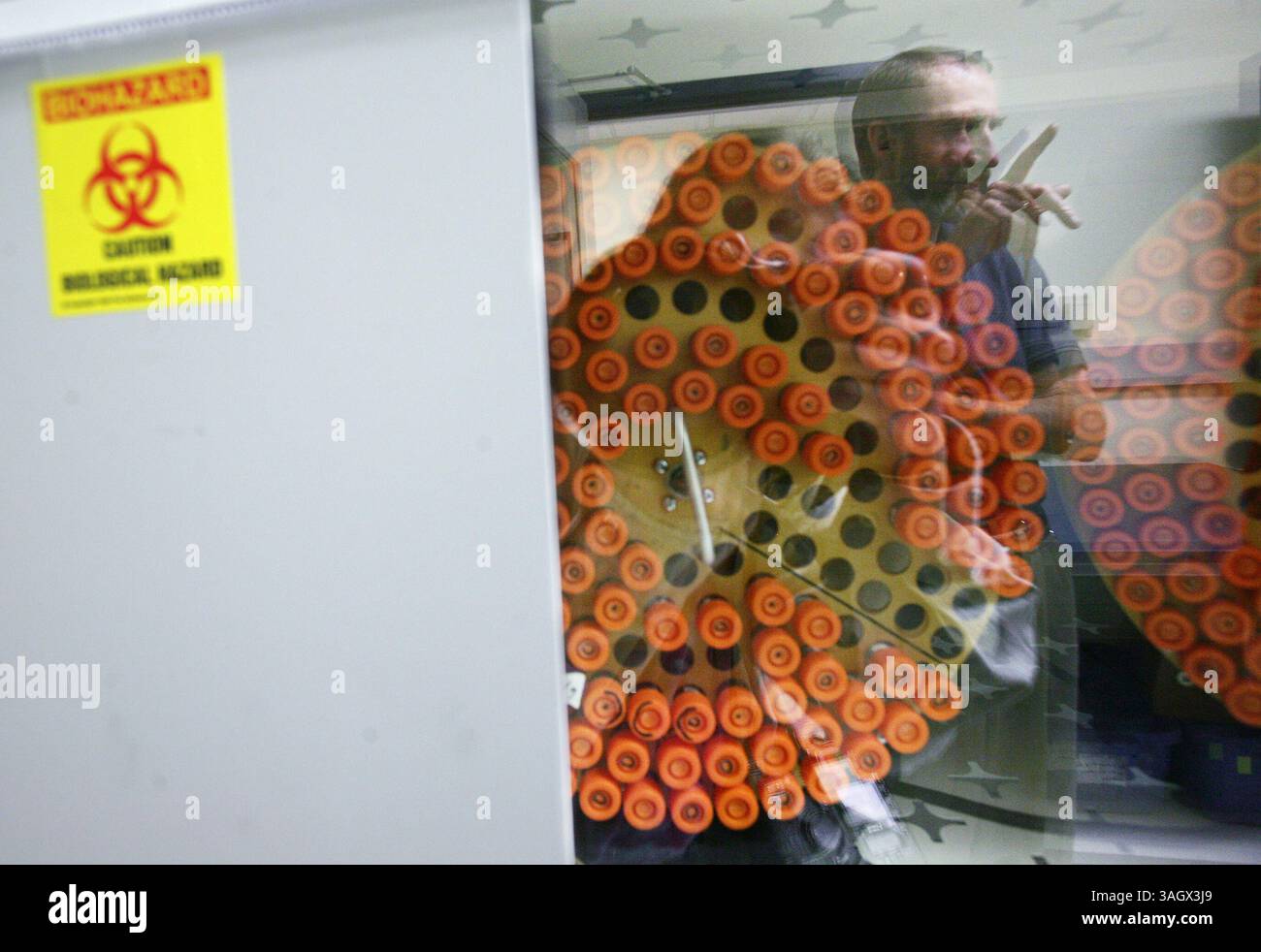 Eric Engman/News-Miner.Roller drums turn respiratory specimens in an ...