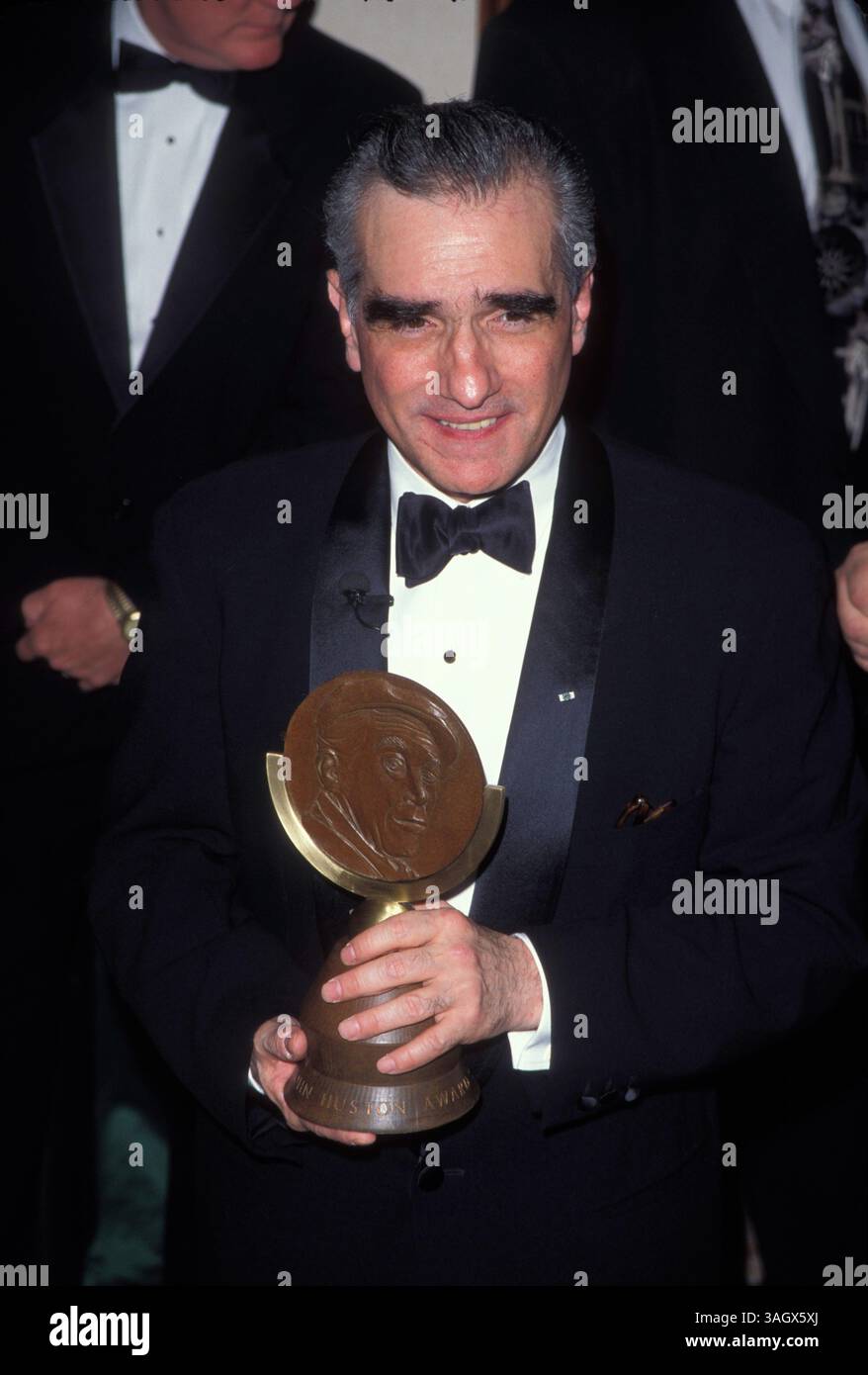 Feb 16, 1996 - Hollywood, California, USA - MARTIN SCORSESE (holding ...