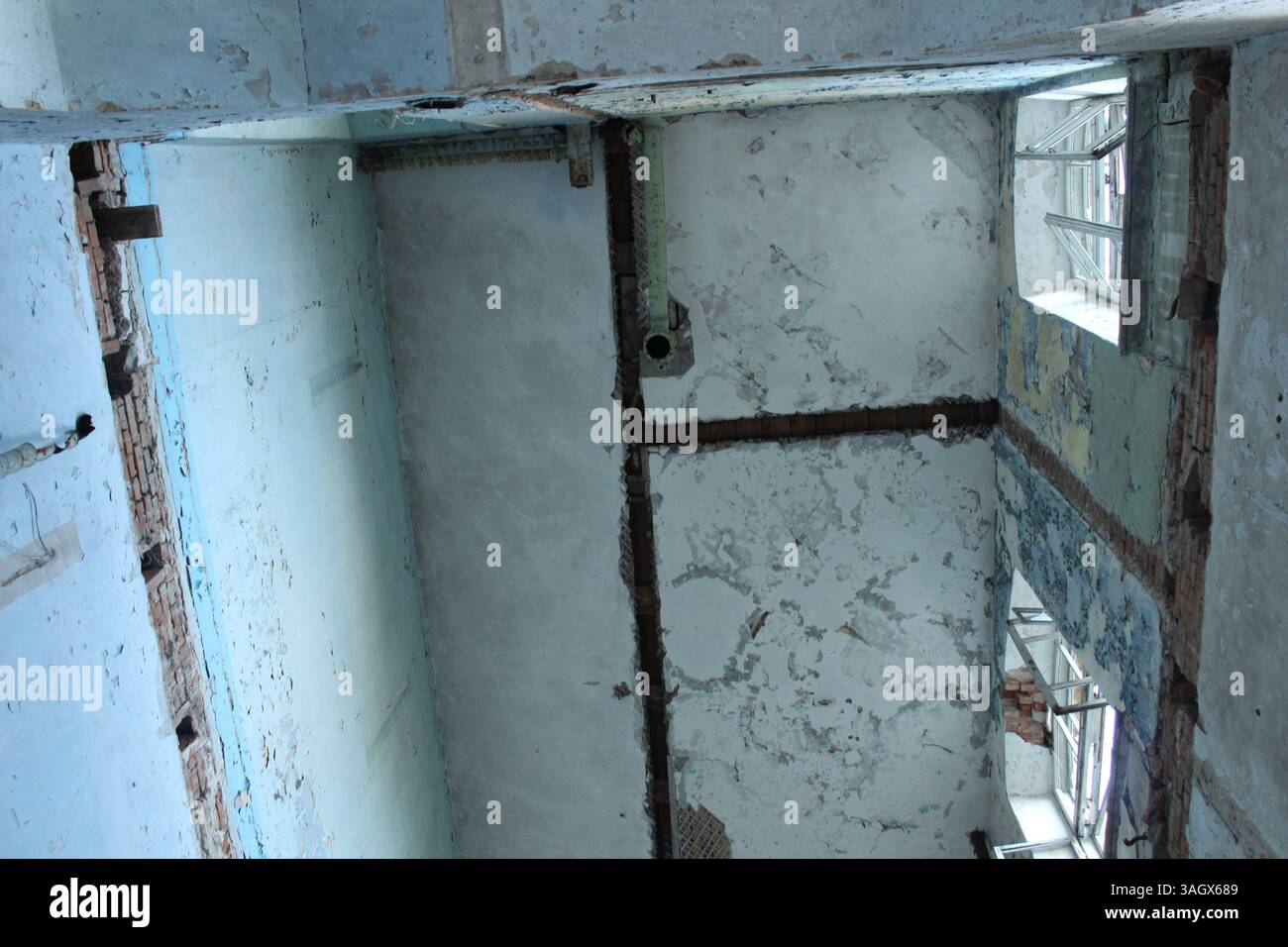 An old ruined house with collapsed stairs and floor slabs Stock Photo ...